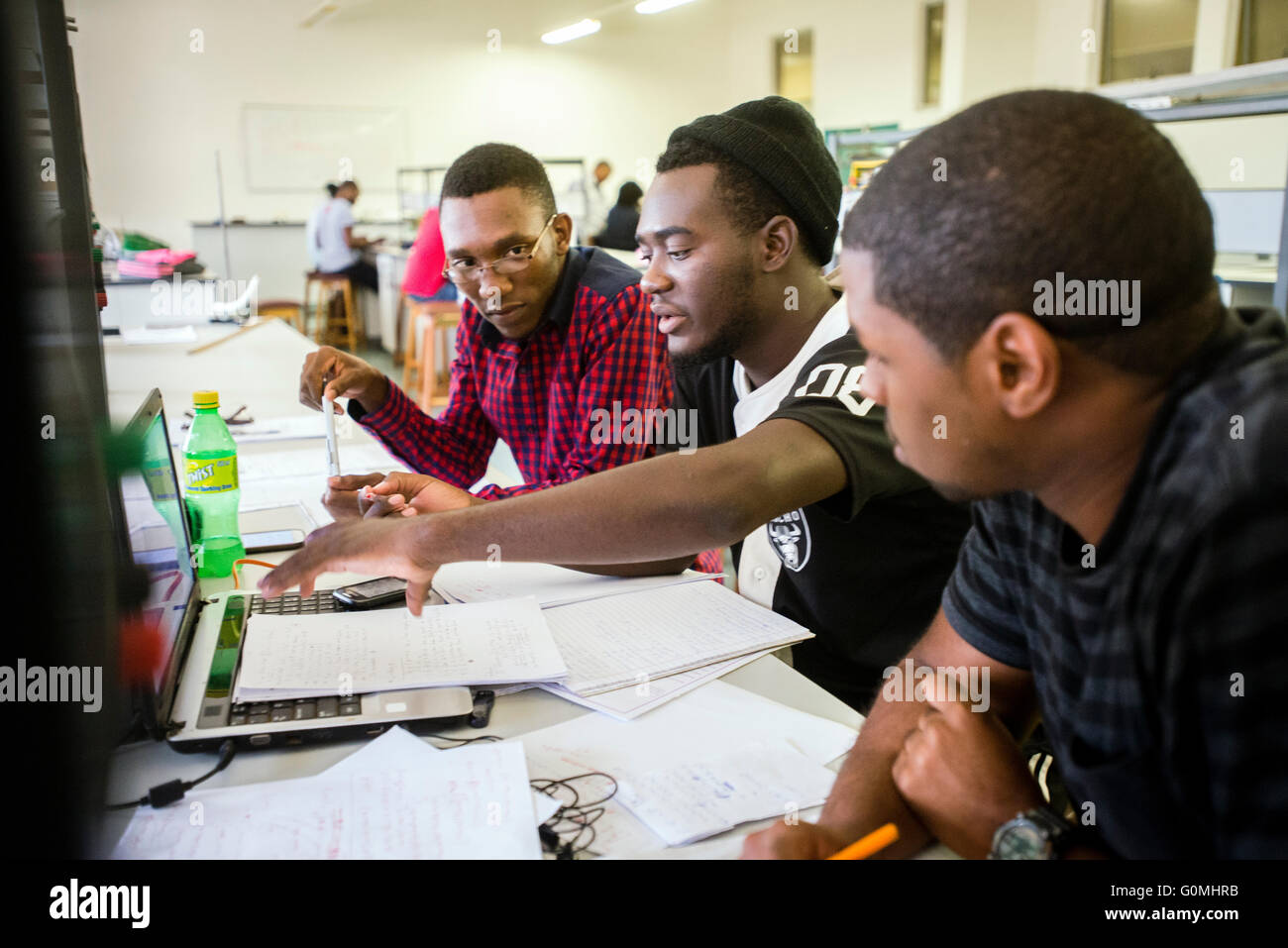 Physicists do their home task before a lesson at physics laboratory in ...