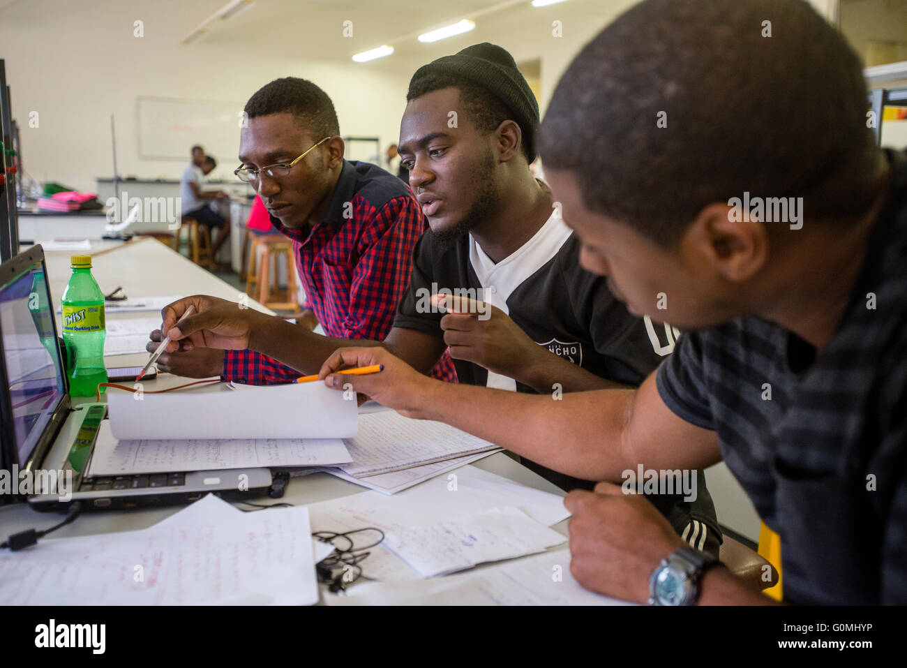 Physicists do their home task before a lesson at physics laboratory in ...