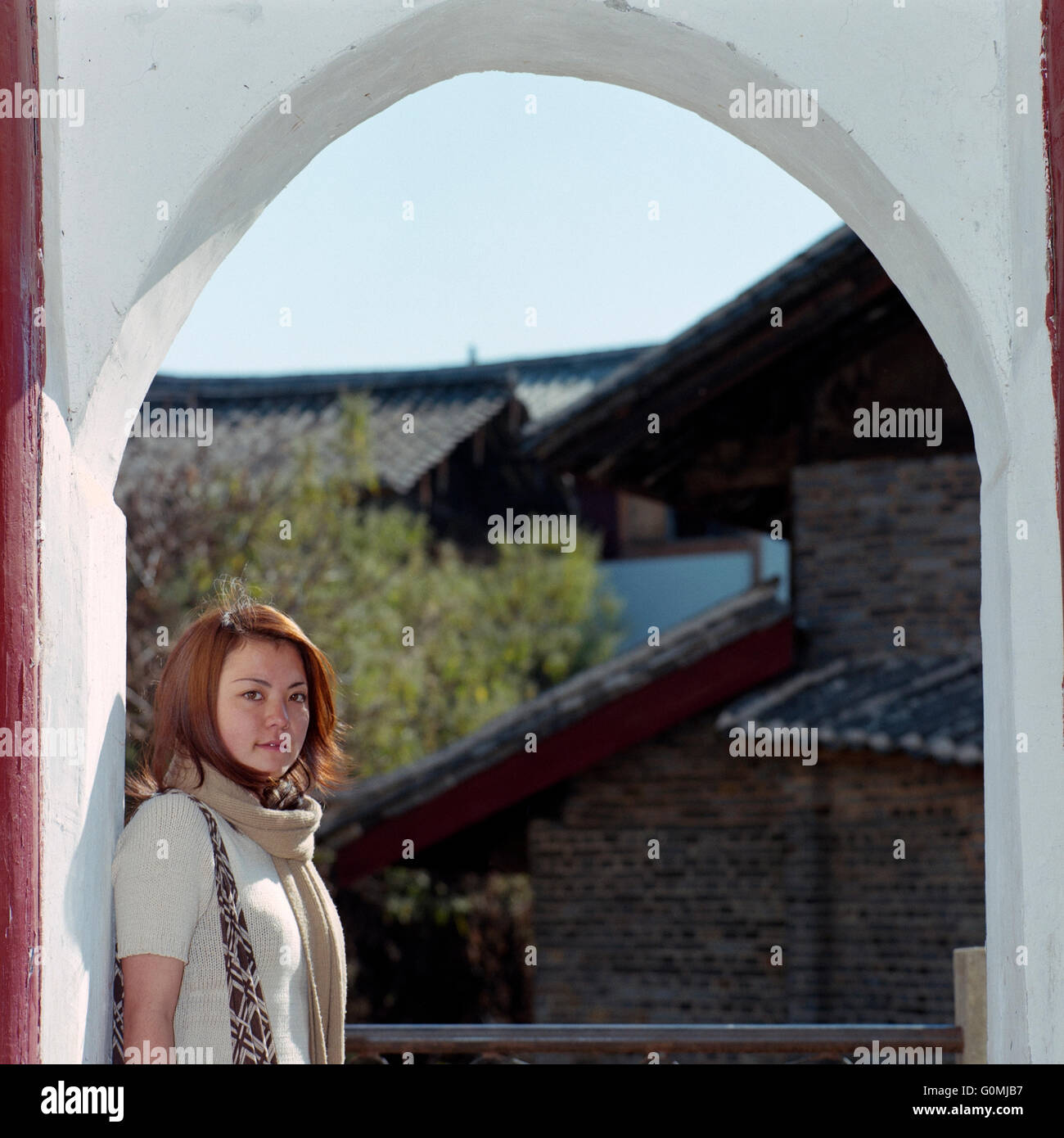 young pretty local tourist poses for picture in china Stock Photo - Alamy