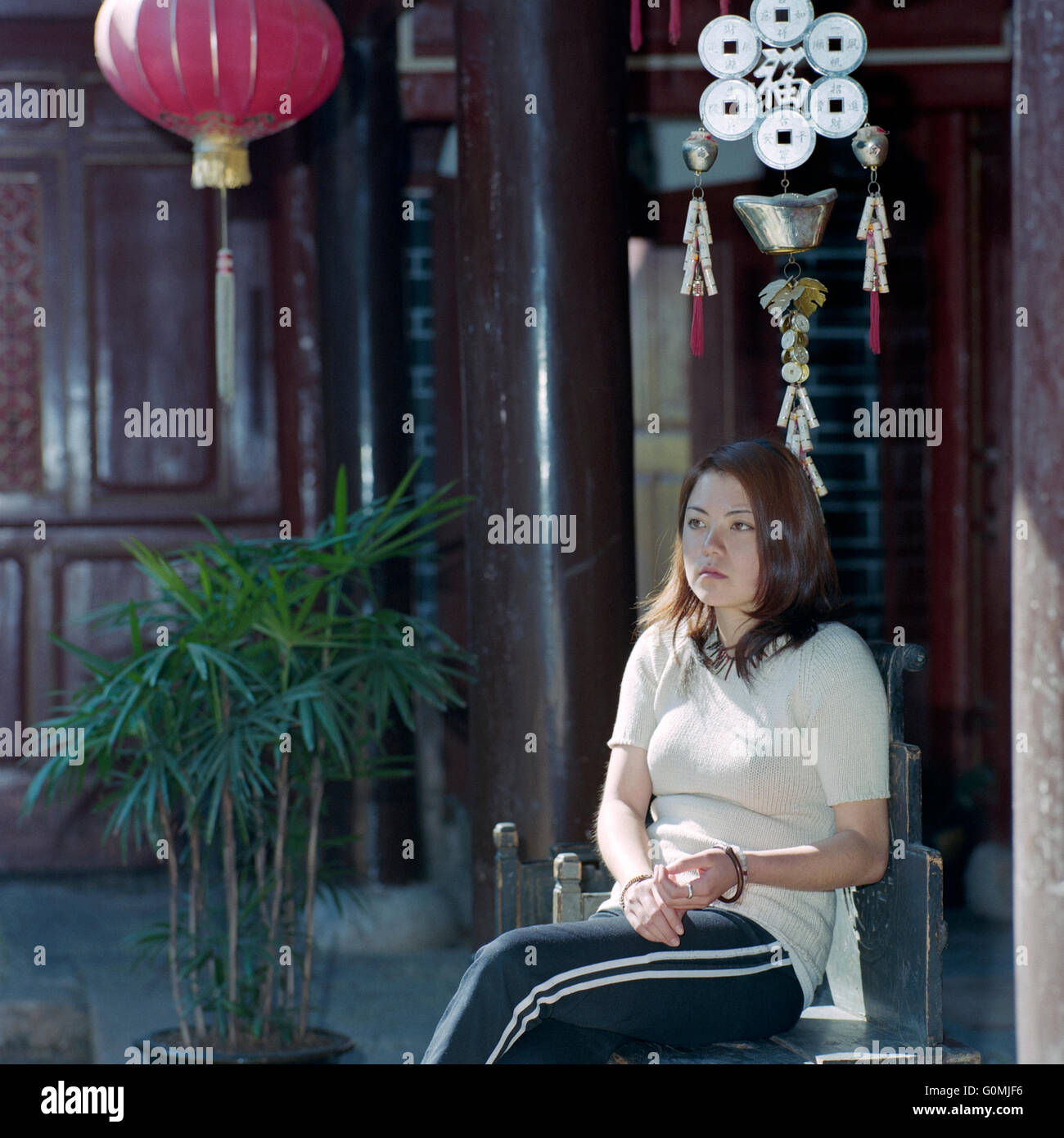 young pretty local tourist poses for picture in china Stock Photo - Alamy