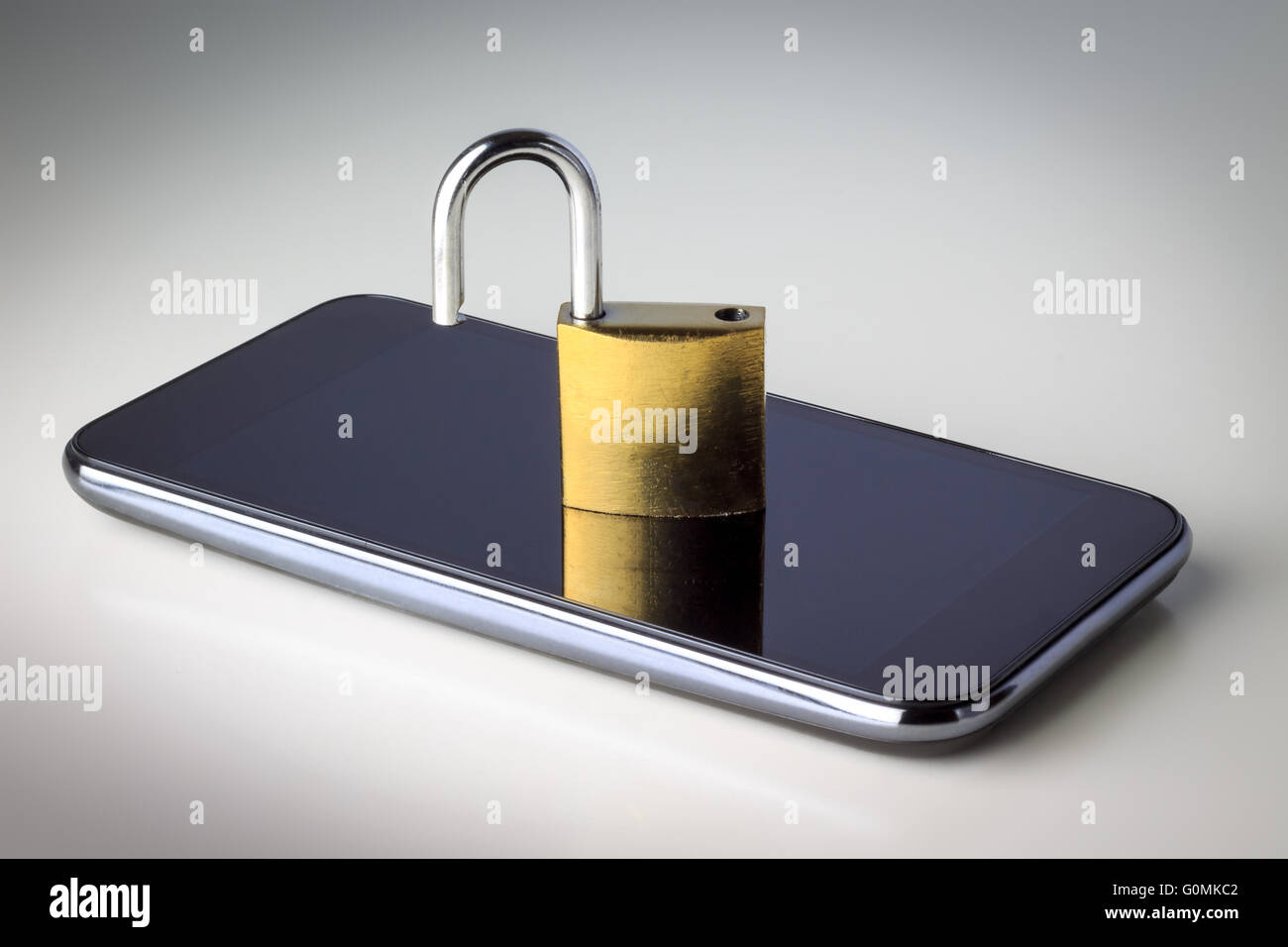 Unlocked padlock on mobile phone. Concept image for mobile phone ...