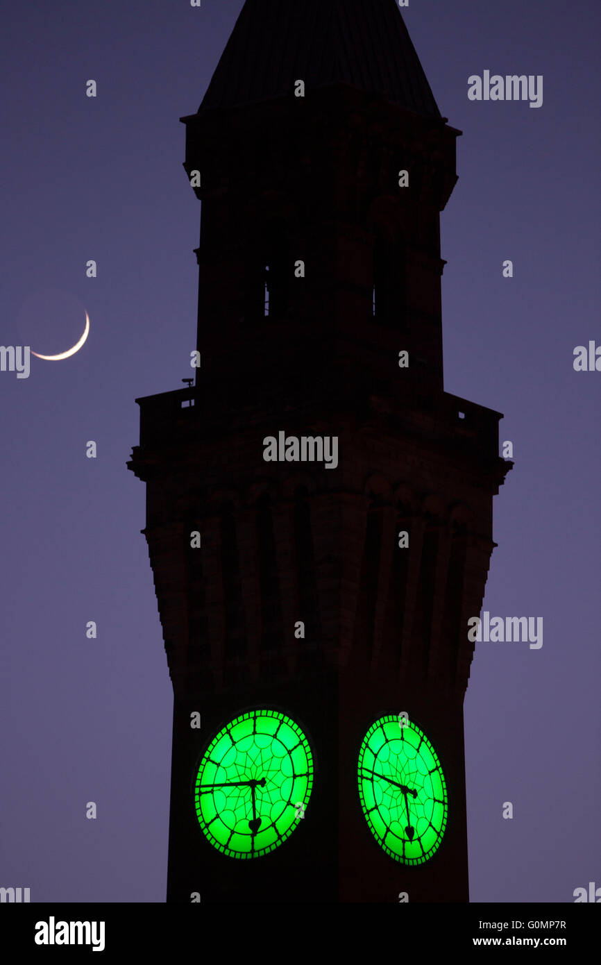A new Moon rising behind the famous "Old Joe" clock tower at the ...