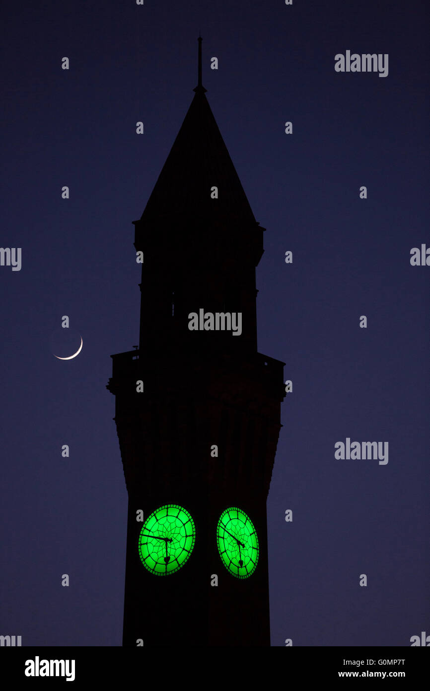 A new Moon rising behind the famous "Old Joe" clock tower at the ...