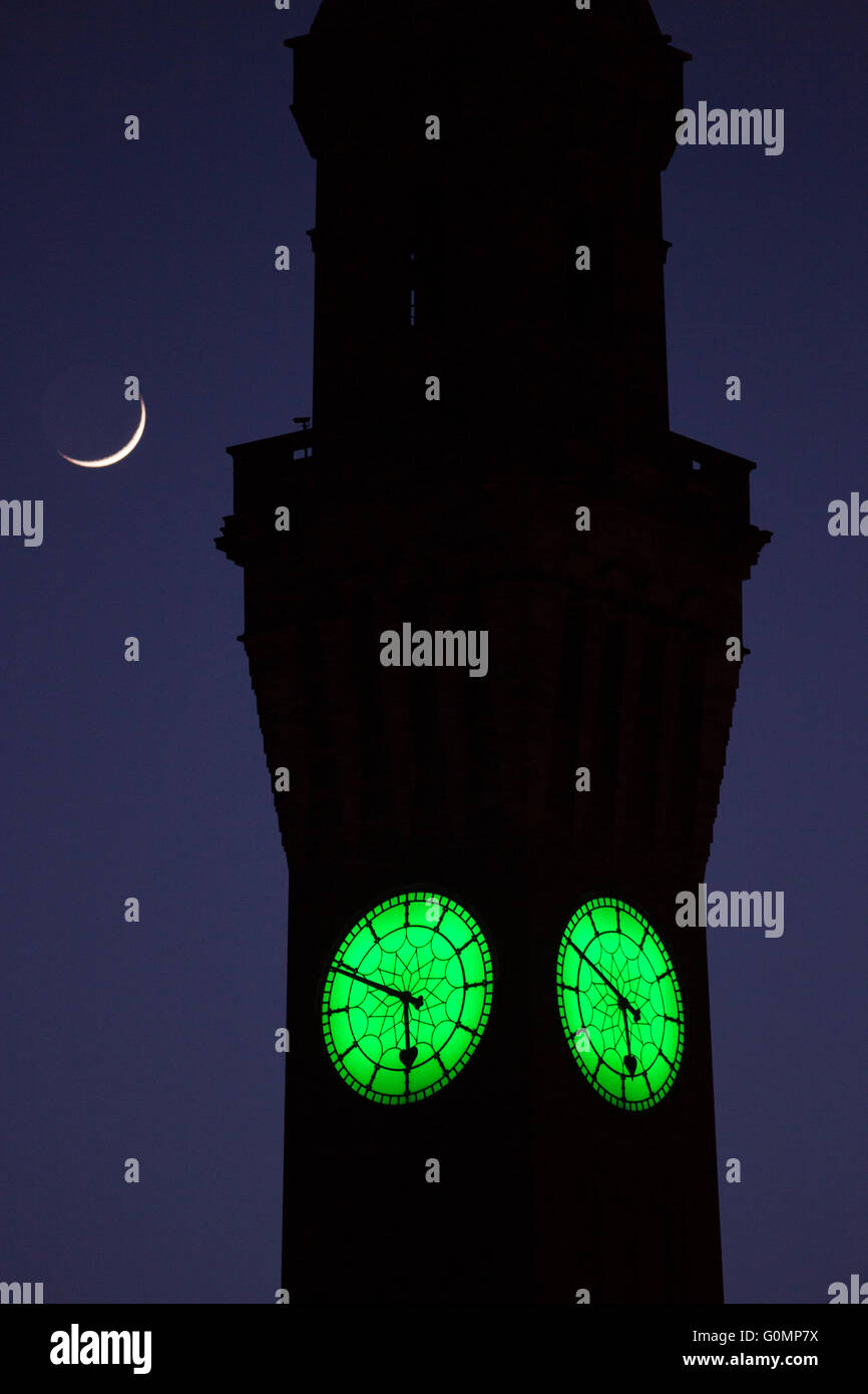 A new Moon rising behind the famous "Old Joe" clock tower at the ...