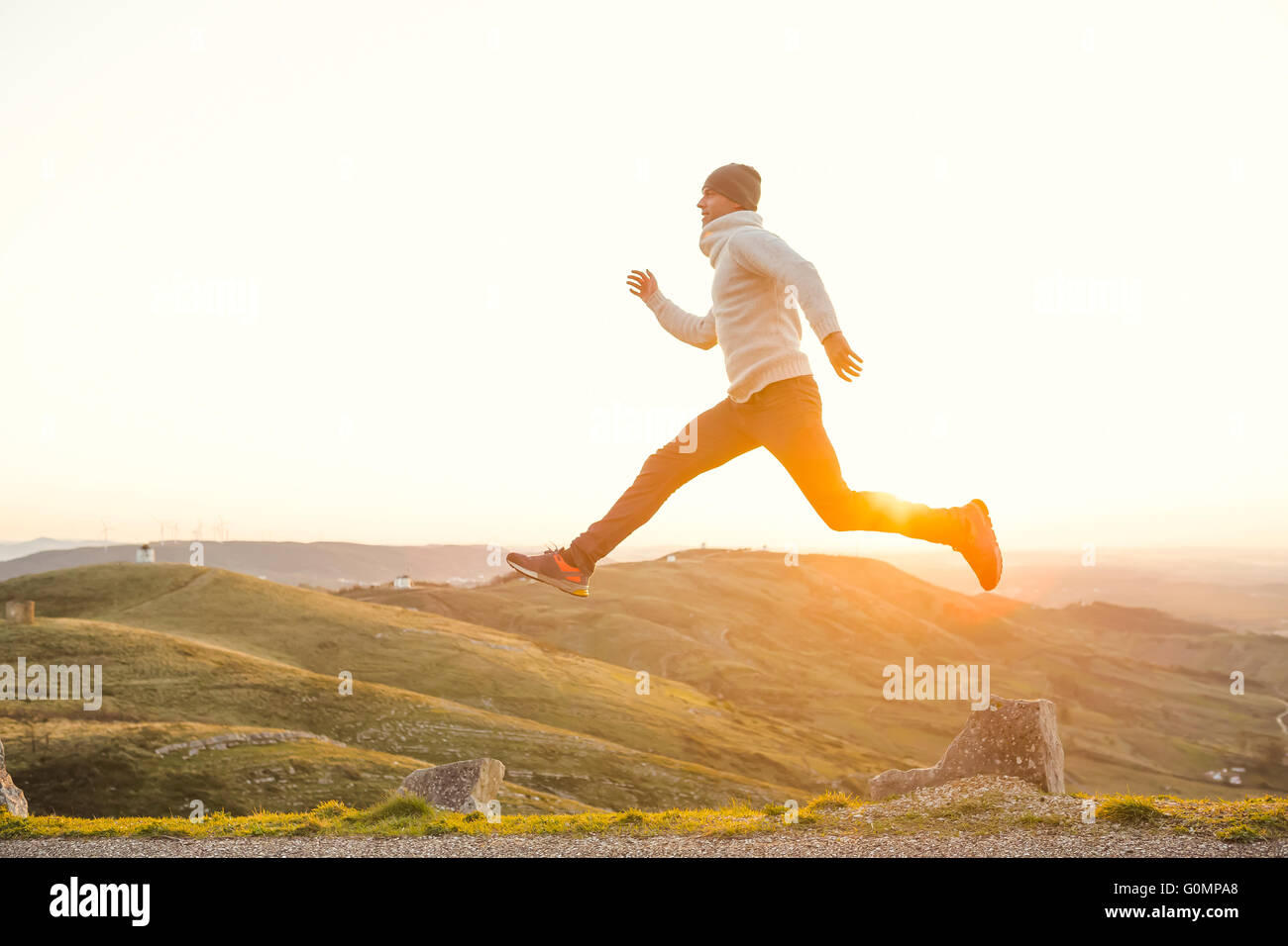 Man in outdoor running and jumping Stock Photo - Alamy