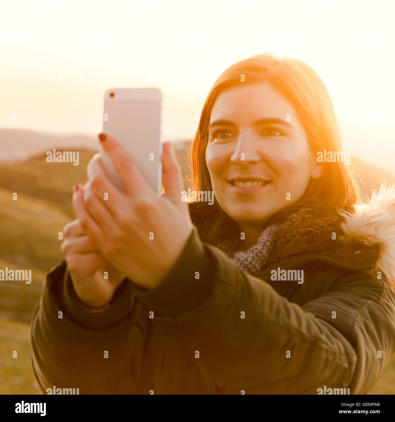 Beautiful woman taking photo cellphone hi-res stock photography and ...