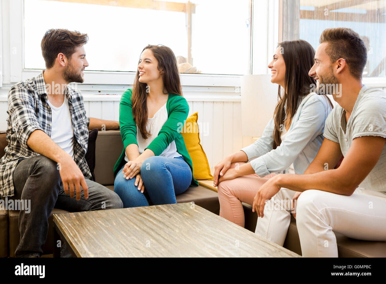 Friends meeting at the local coffee shop and having fun Stock Photo - Alamy