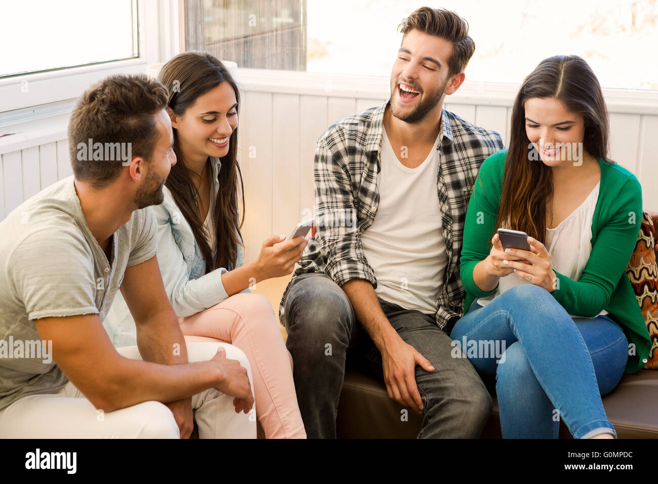 Friends meeting at the local coffee shop and having fun Stock Photo - Alamy