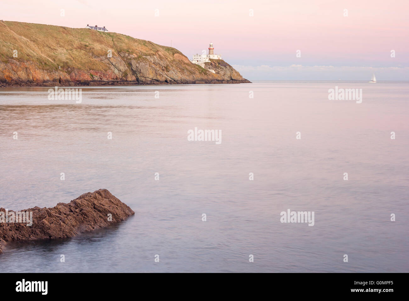 Baily lighthouse at the sunset in Howth peninsula, Dublin, Ireland ...