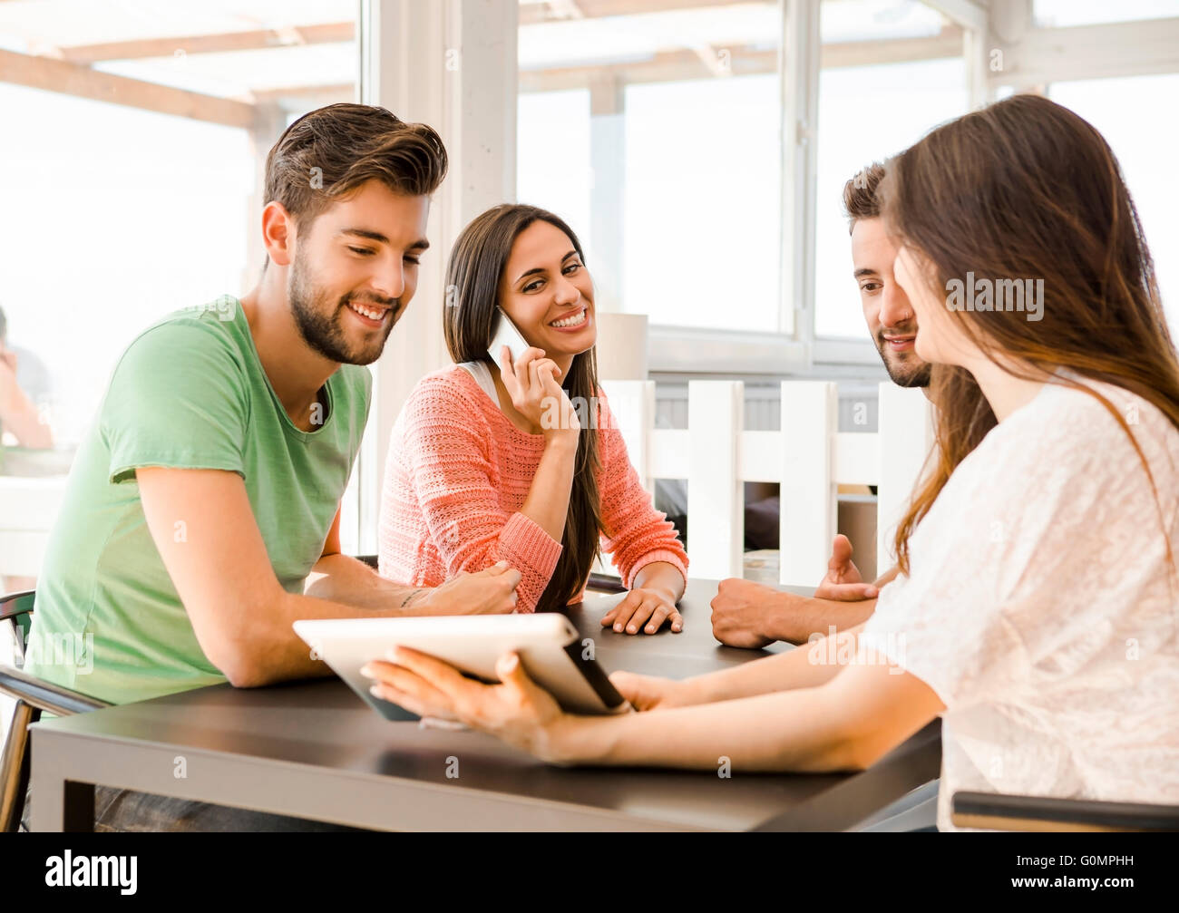Group of friends meeting In the local Coffee Shop Stock Photo - Alamy