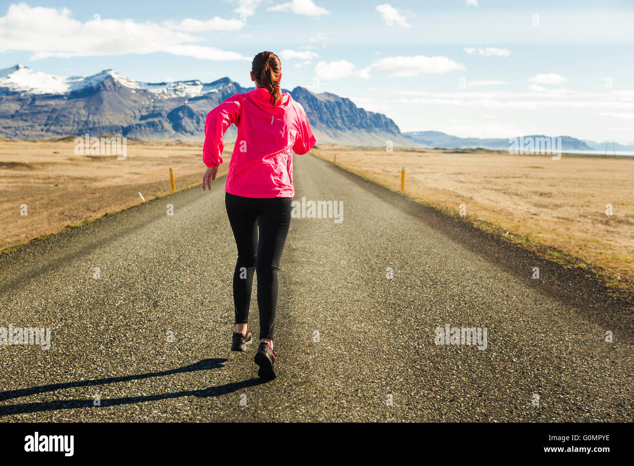 Shot of a beautiful woman running in a beautiful afternoon Stock Photo ...