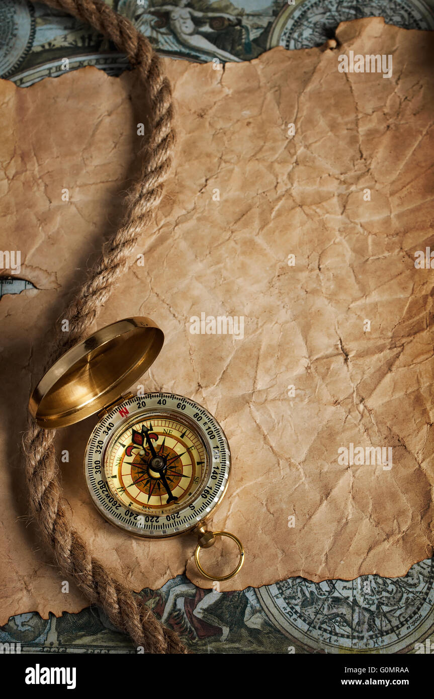 Nautical background with retro compass on old yellowed paper Stock ...