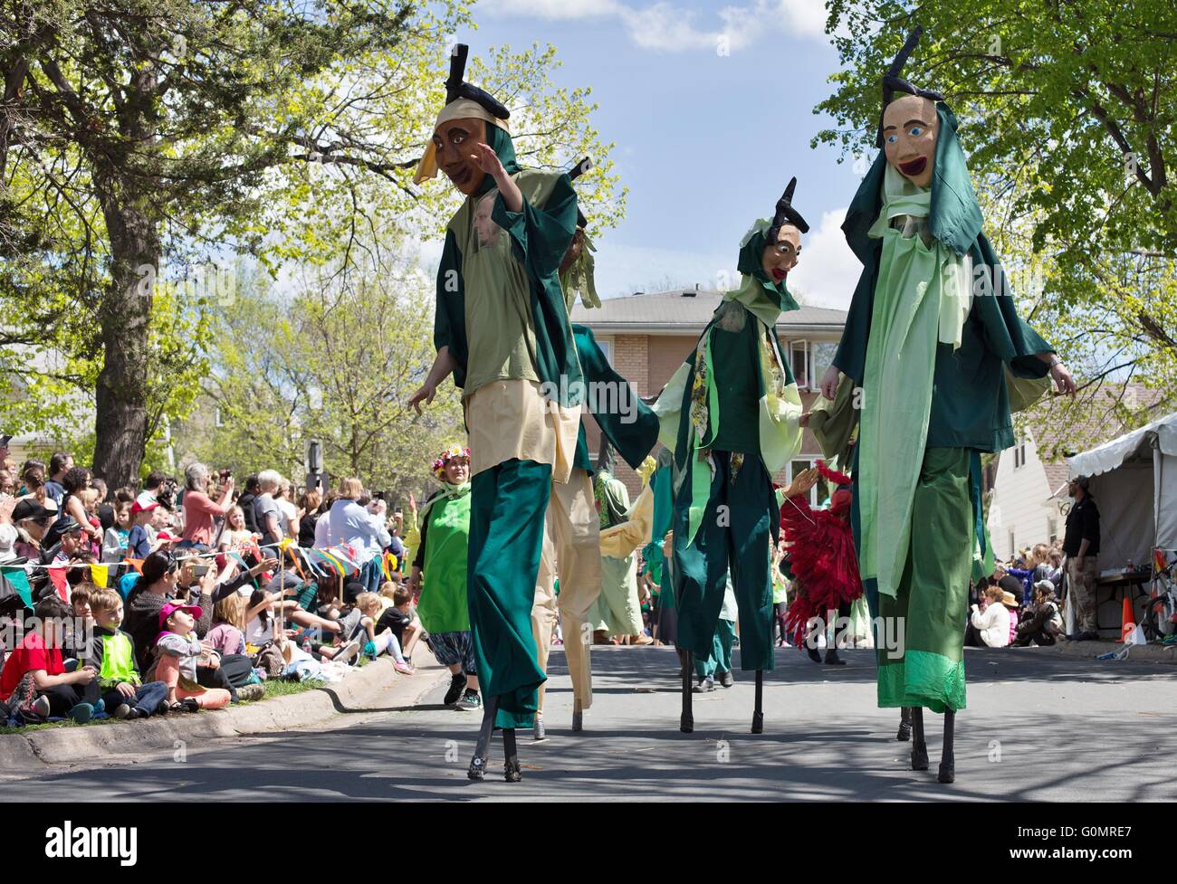 People on stilts at the May Day celebration including parade and ...