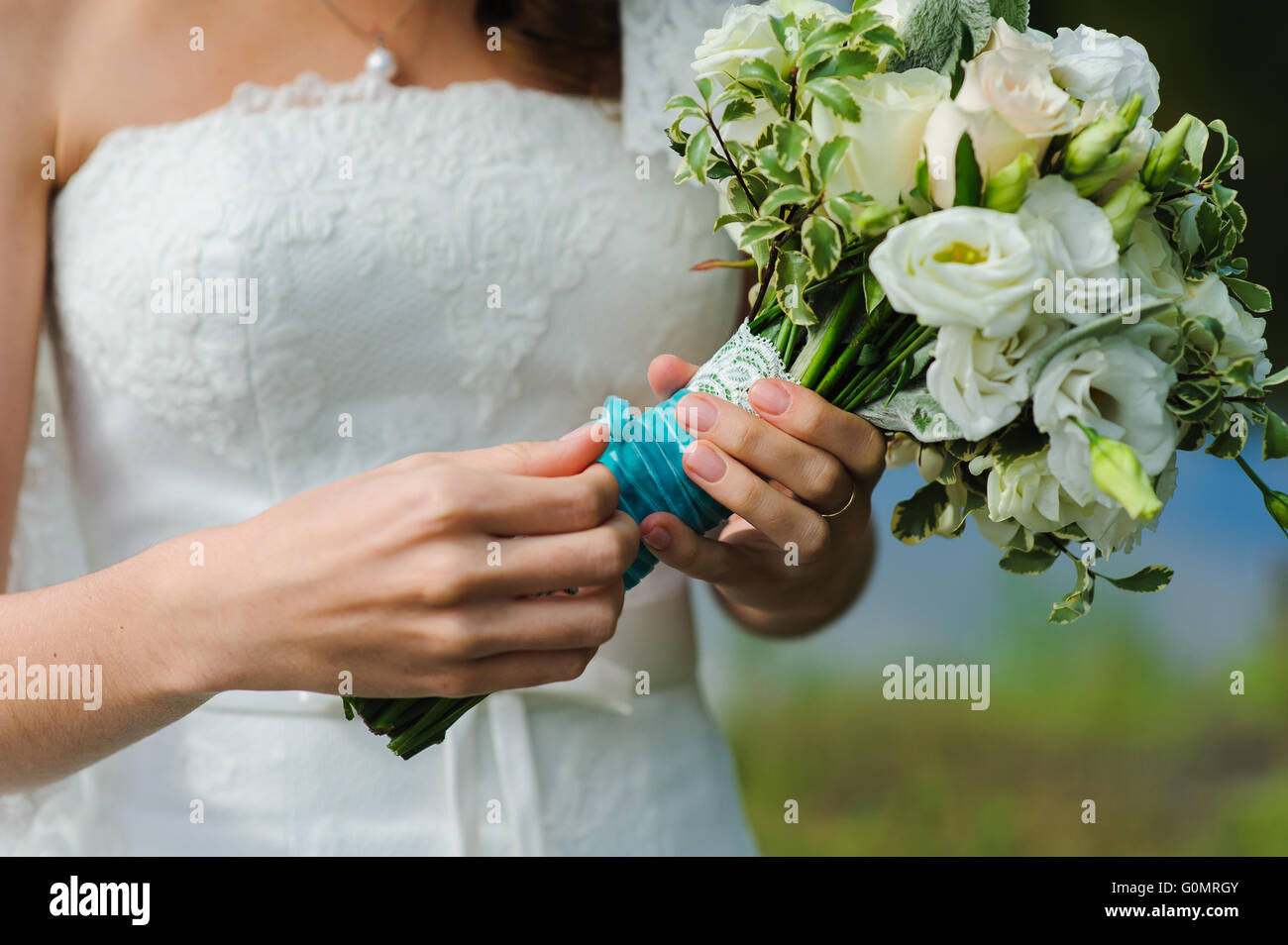Bride holds a wedding bouquet Stock Photo - Alamy