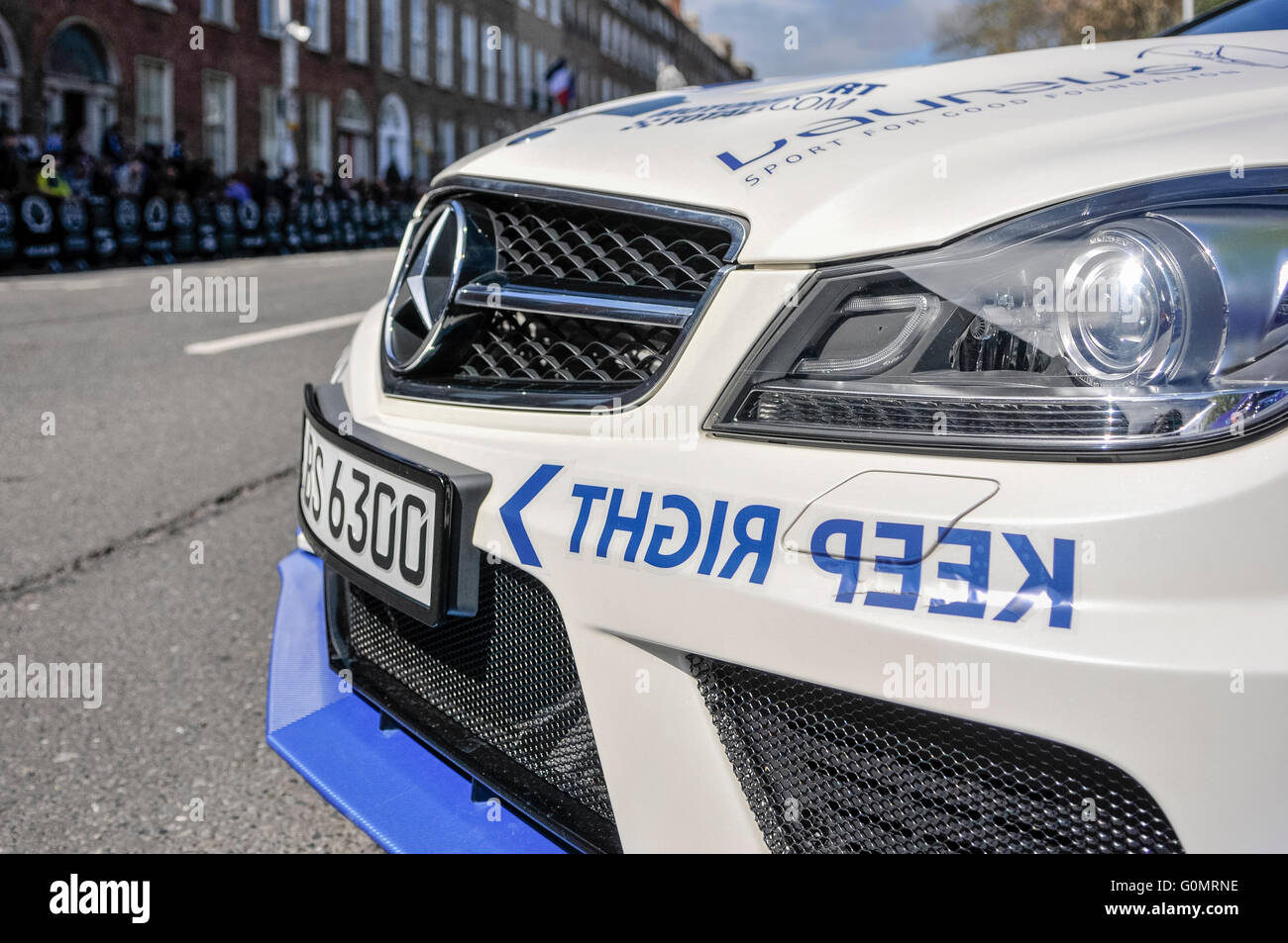 A Mercedes C63 has a "KEEP RIGHT" message painted in reverse on its ...