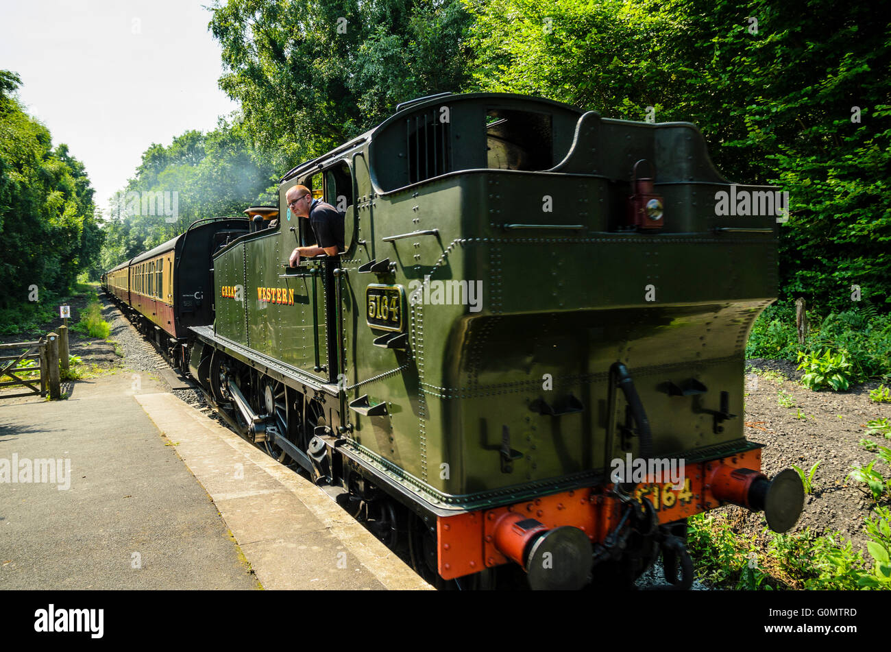 Ex-Great Western Railway tank engine No. 5164 hauls a train on the ...