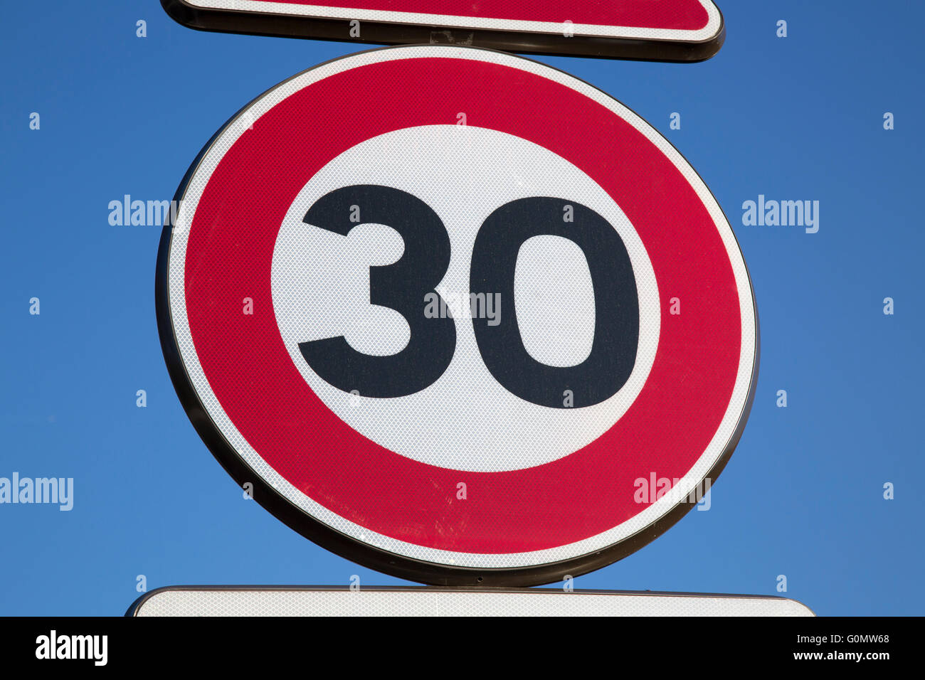 Thirty Speed Sign against Blue Sky Background Stock Photo - Alamy
