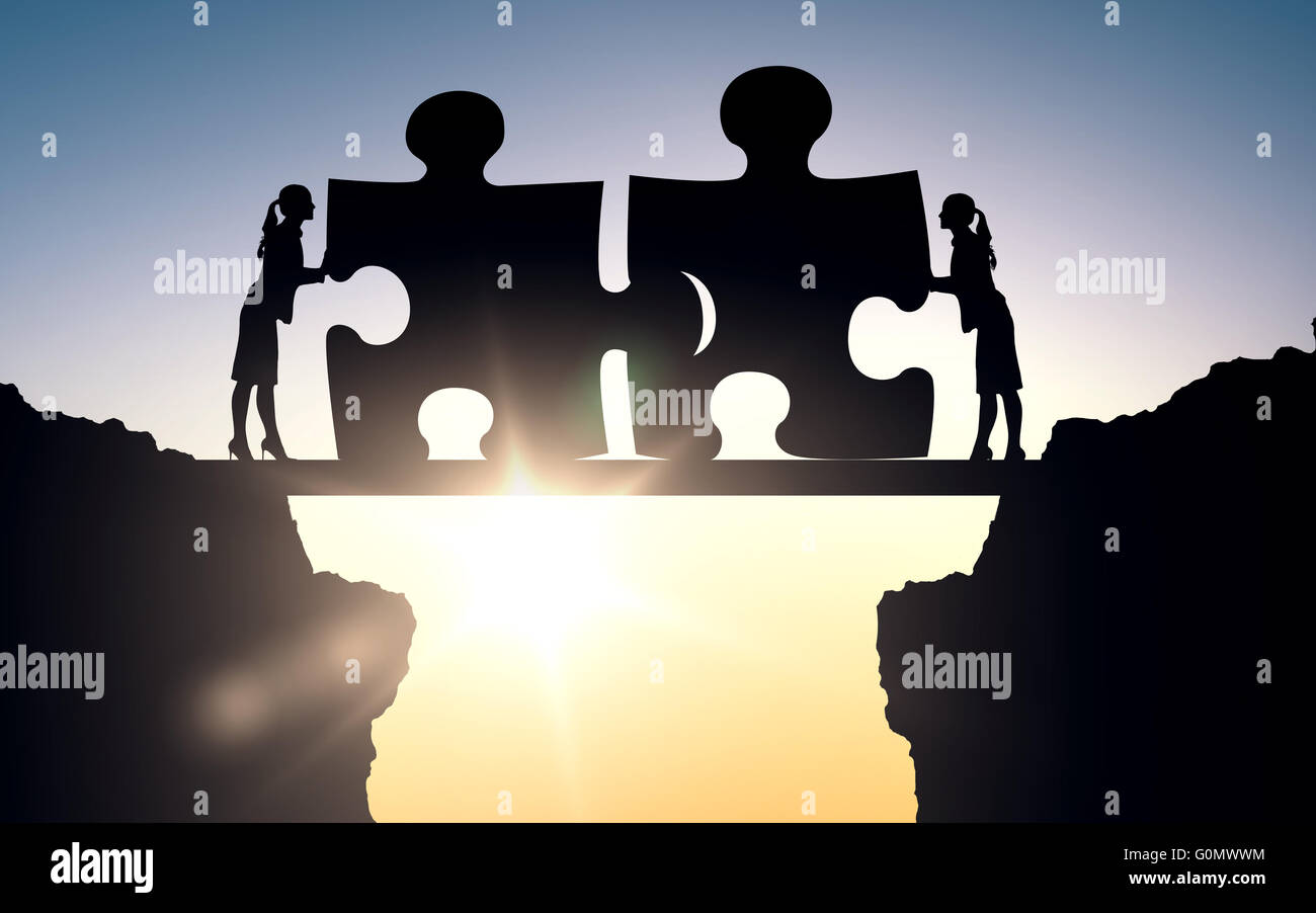 silhouette of two business women connecting puzzle Stock Photo - Alamy
