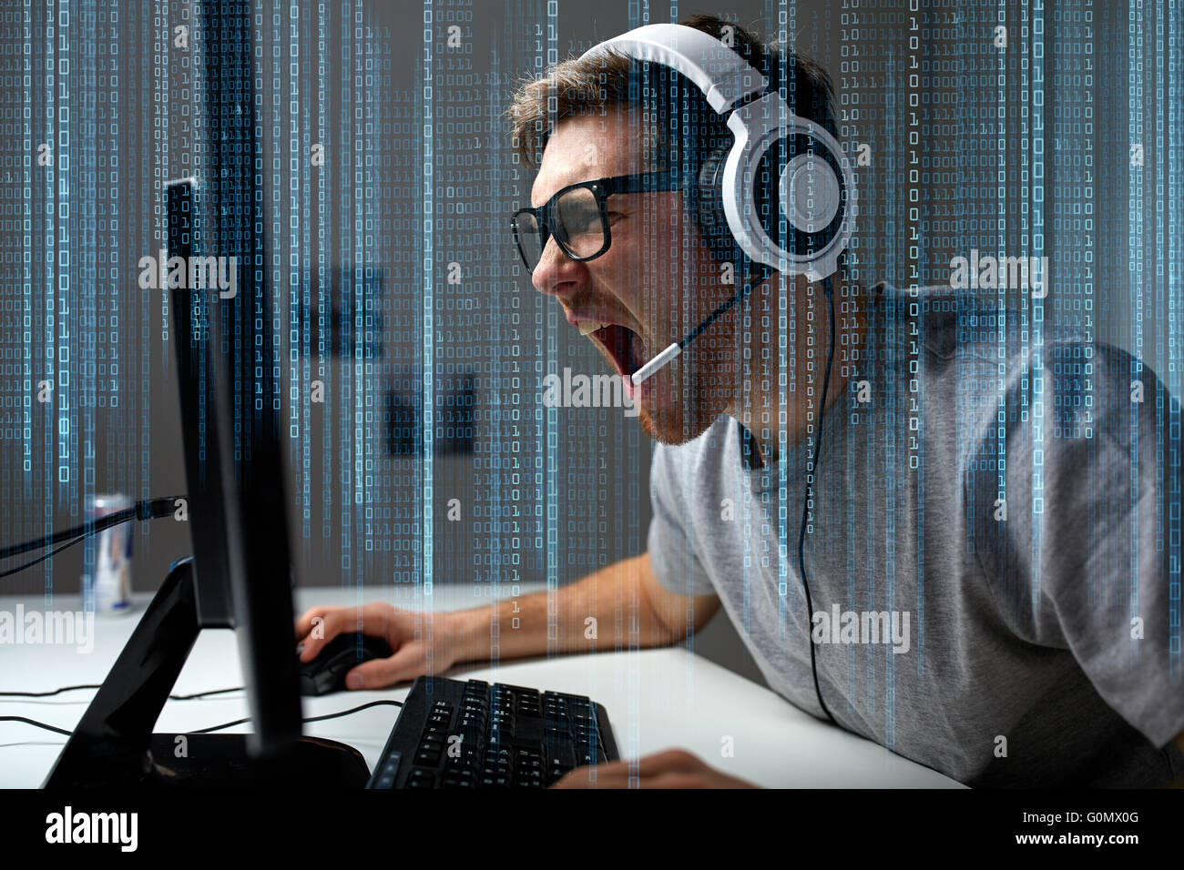 man in headset playing computer video game at home Stock Photo - Alamy