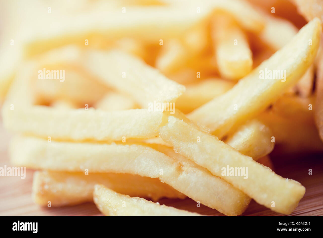 close up of french fries on table Stock Photo - Alamy