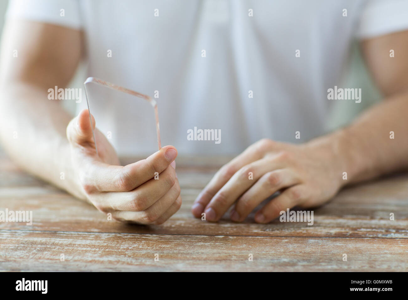 close up of male hand with transparent smartphone Stock Photo - Alamy