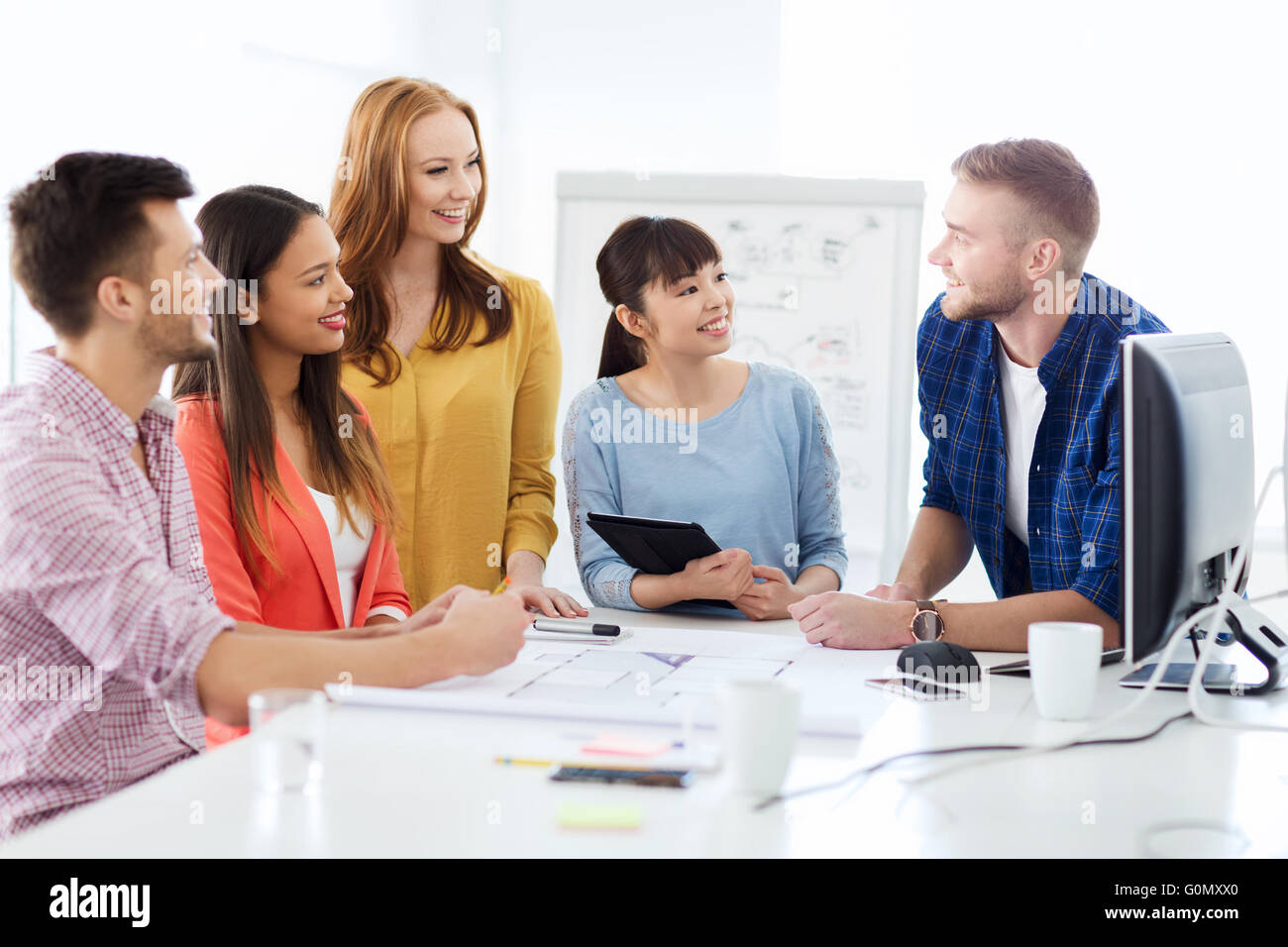 happy creative team or students working at office Stock Photo - Alamy