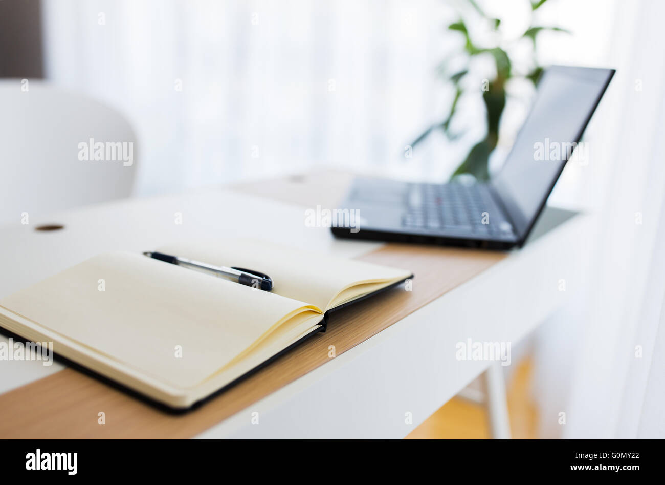 notebook and laptop computer on office table Stock Photo - Alamy
