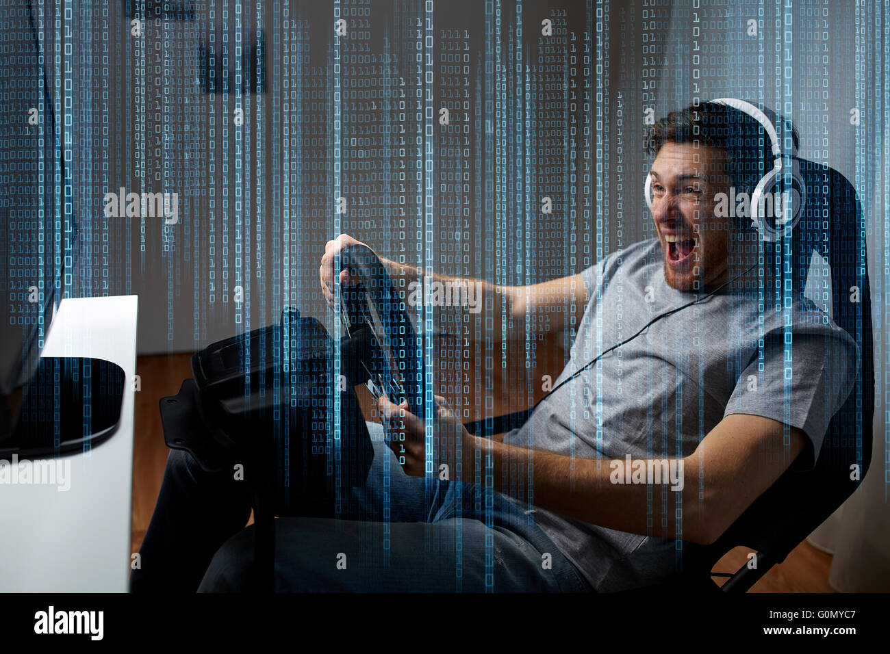 man playing car racing video game at home Stock Photo - Alamy