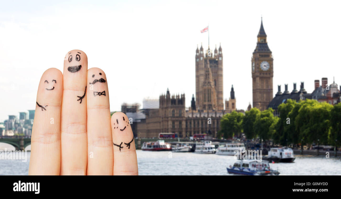 close up of fingers with smiley faces over london Stock Photo - Alamy