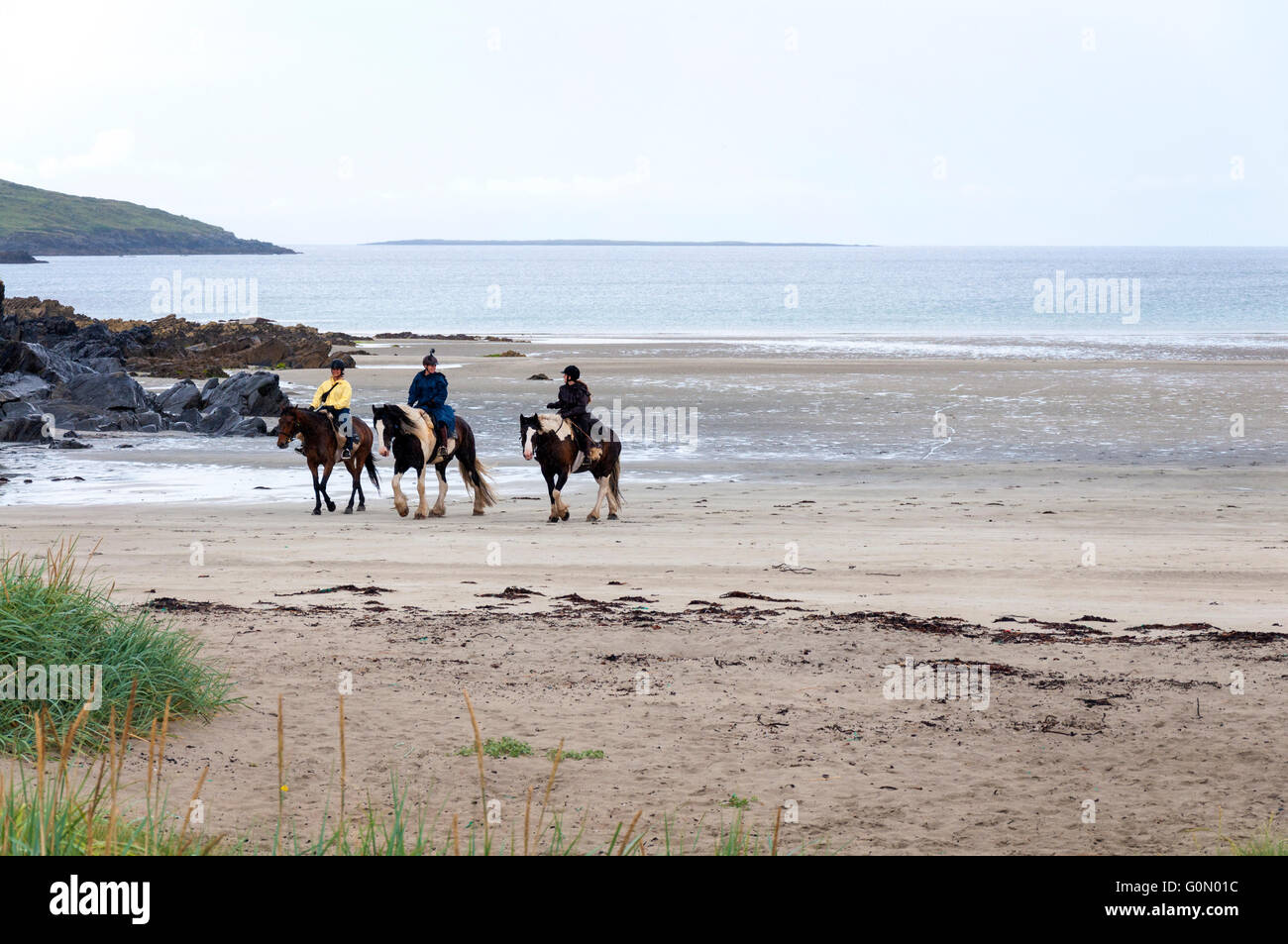 Horse riding on Narin strand beach near Portnoo, County Donegal ...