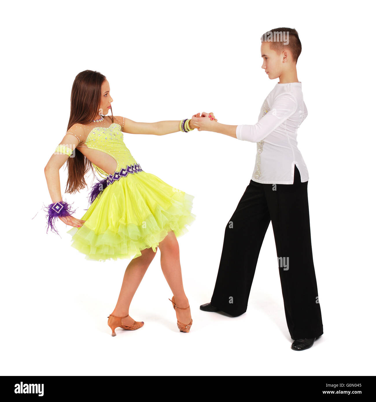Boy and girl dancing ballroom dance on white background Stock Photo - Alamy