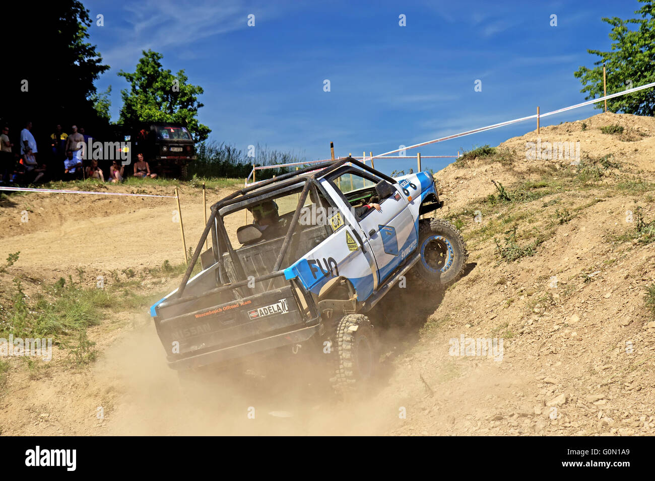 Off-road car is hitting a steep hill in the race Stock Photo - Alamy