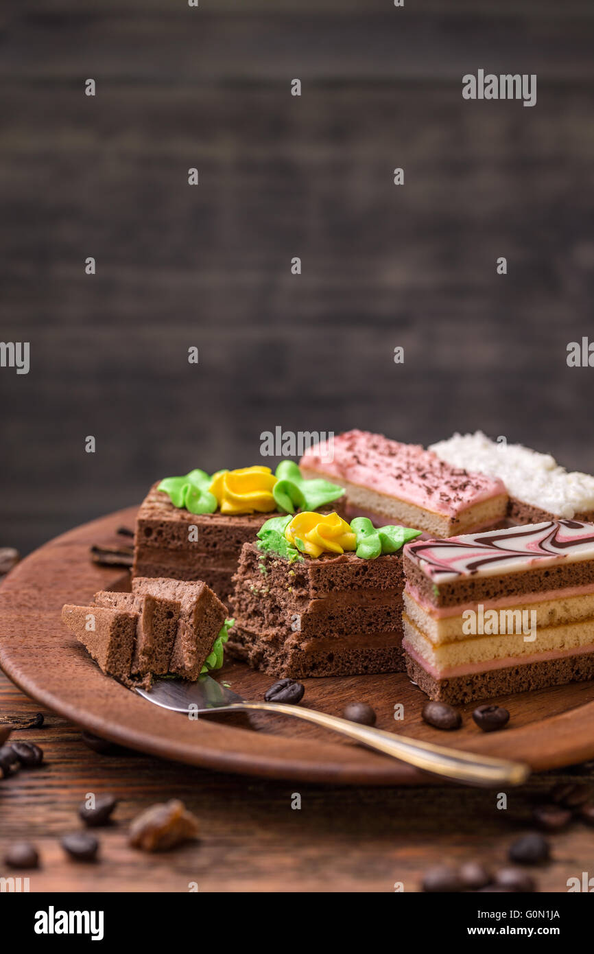 Assorted different mini cakes with cream Stock Photo - Alamy