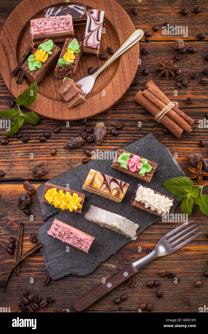 Top view of different sort of small sweet cakes Stock Photo - Alamy