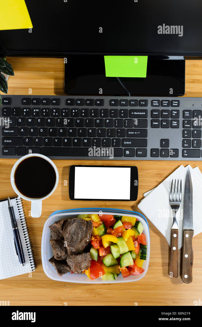 eating at workplace Stock Photo - Alamy