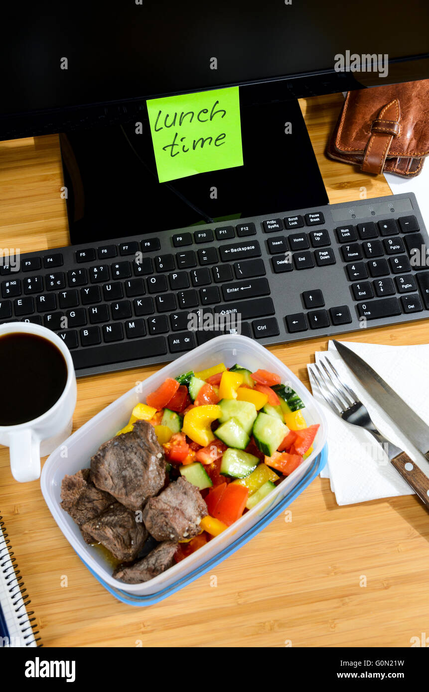 eating at workplace Stock Photo - Alamy