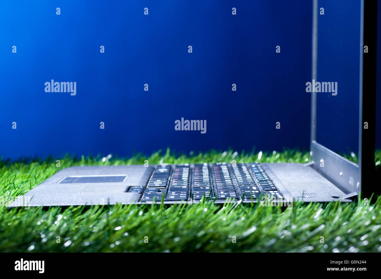 laptop in grass Stock Photo - Alamy