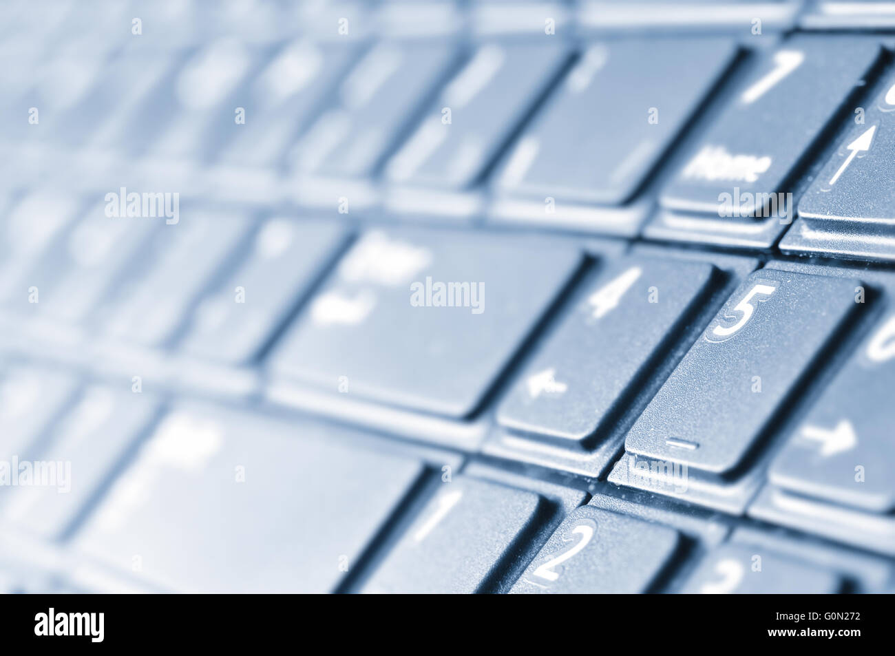 blue toned closeup view of a computer keyboard Stock Photo - Alamy
