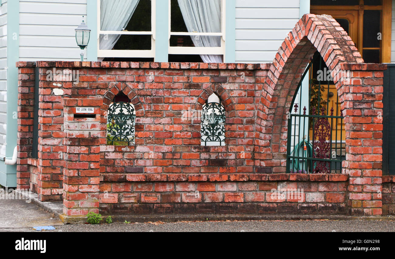 Wonder brick entrance with metal work in it too Stock Photo - Alamy