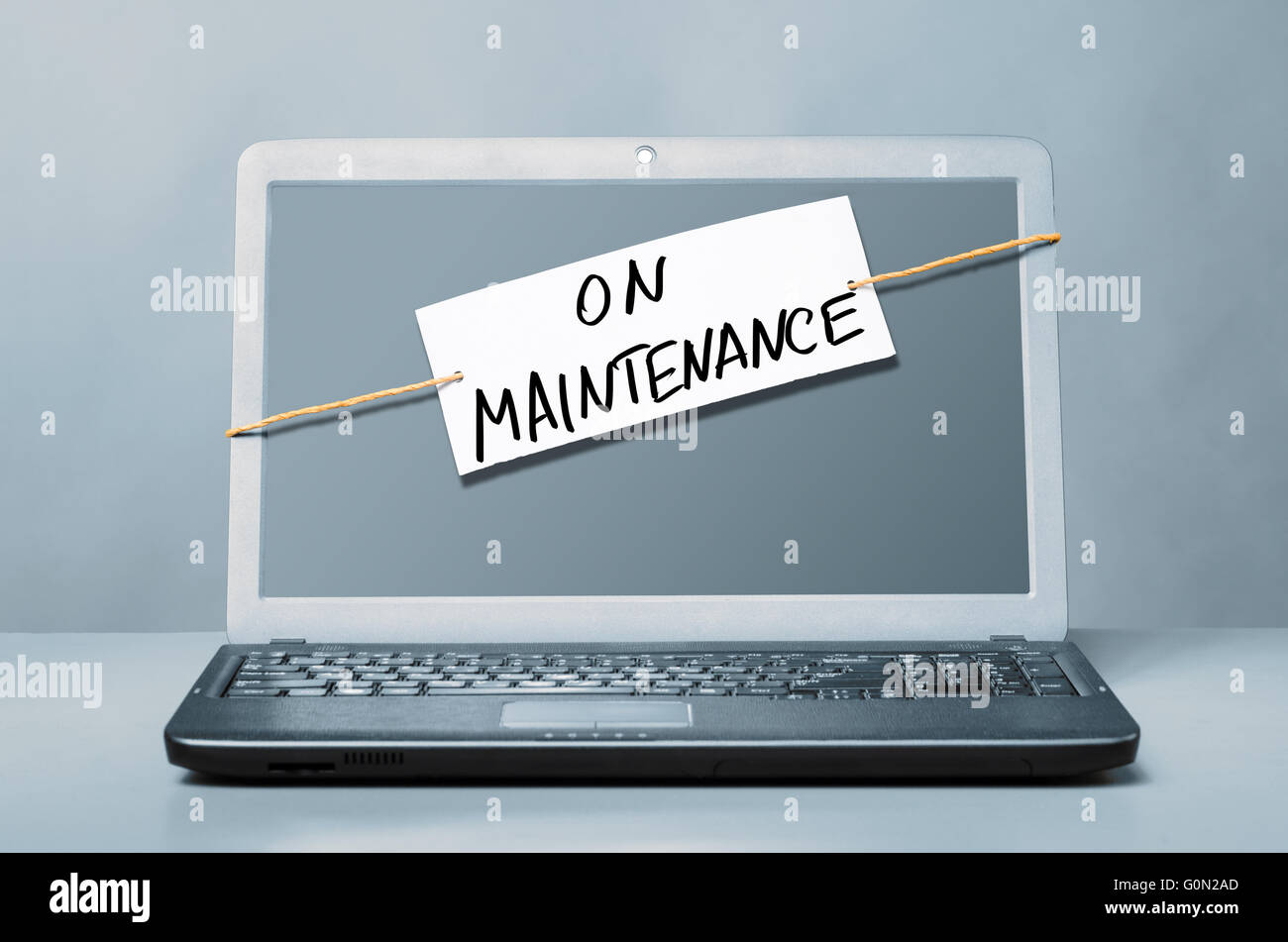 laptop with maintenance note Stock Photo - Alamy