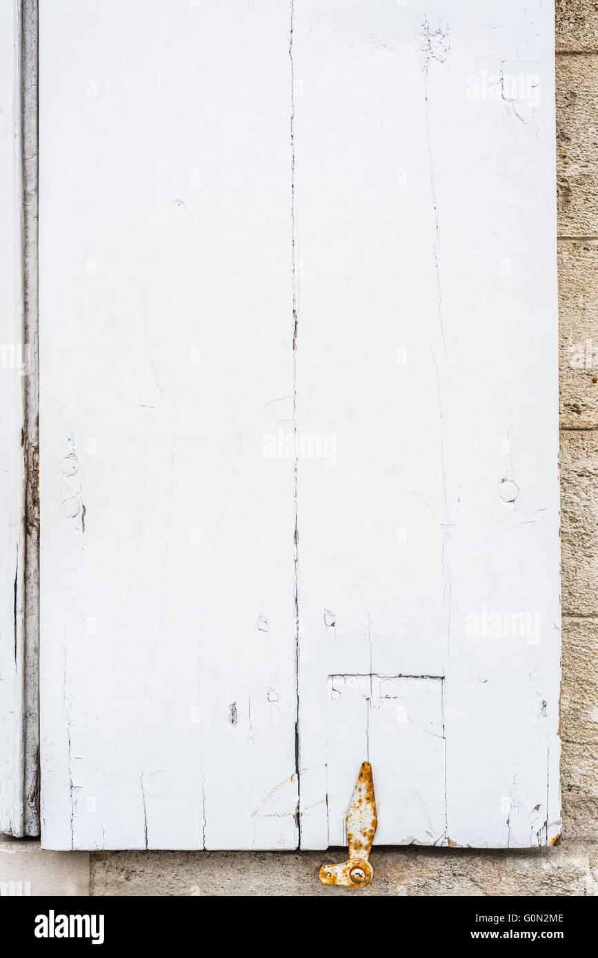 Weathered white wooden window panel with a rusty metal bolt Stock Photo ...