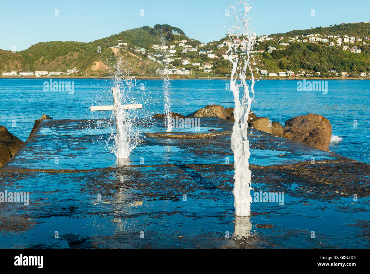 White cross with clean white water splashing up Stock Photo - Alamy
