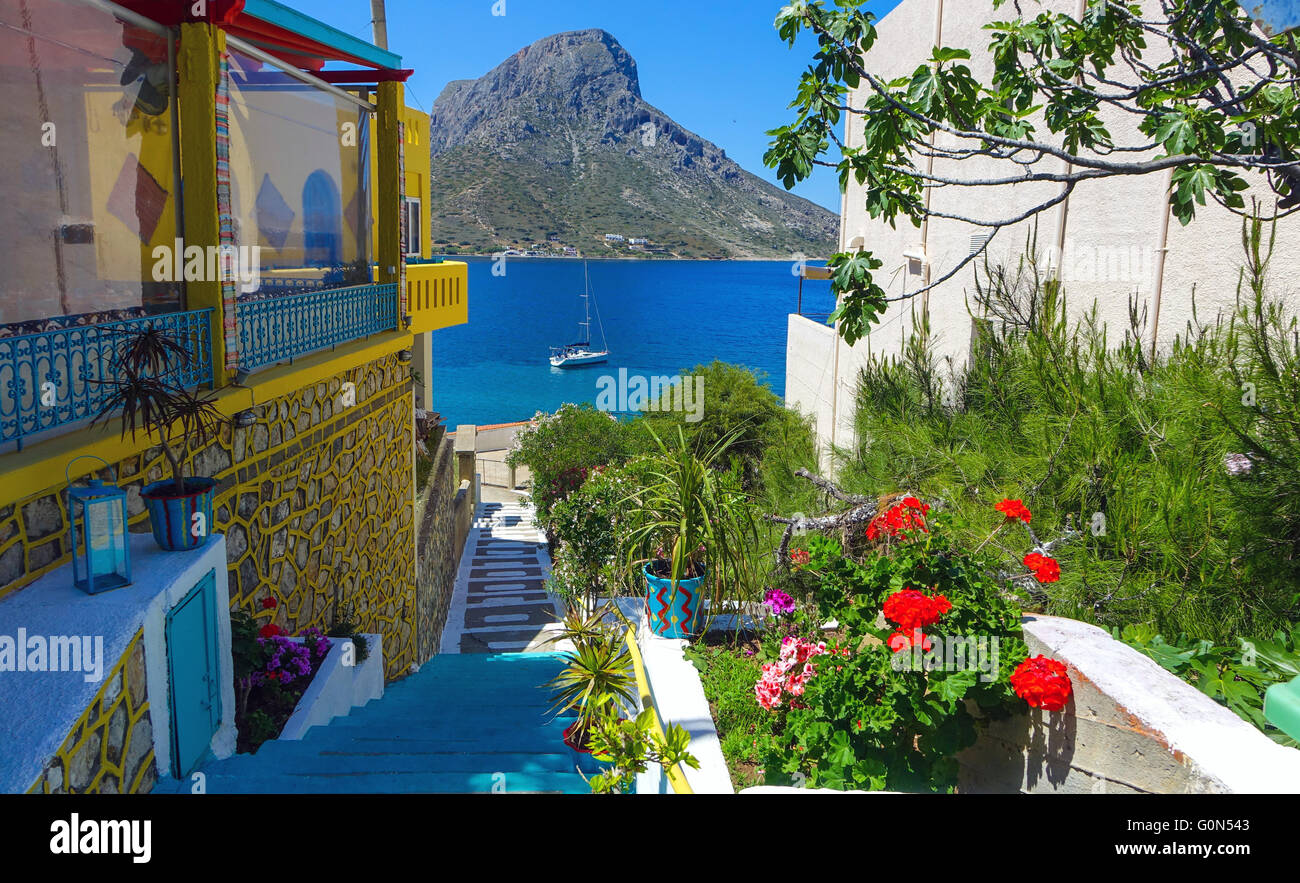 Massouri holiday resort, Kalymnos, Greece with blue steps, moored yacht ...