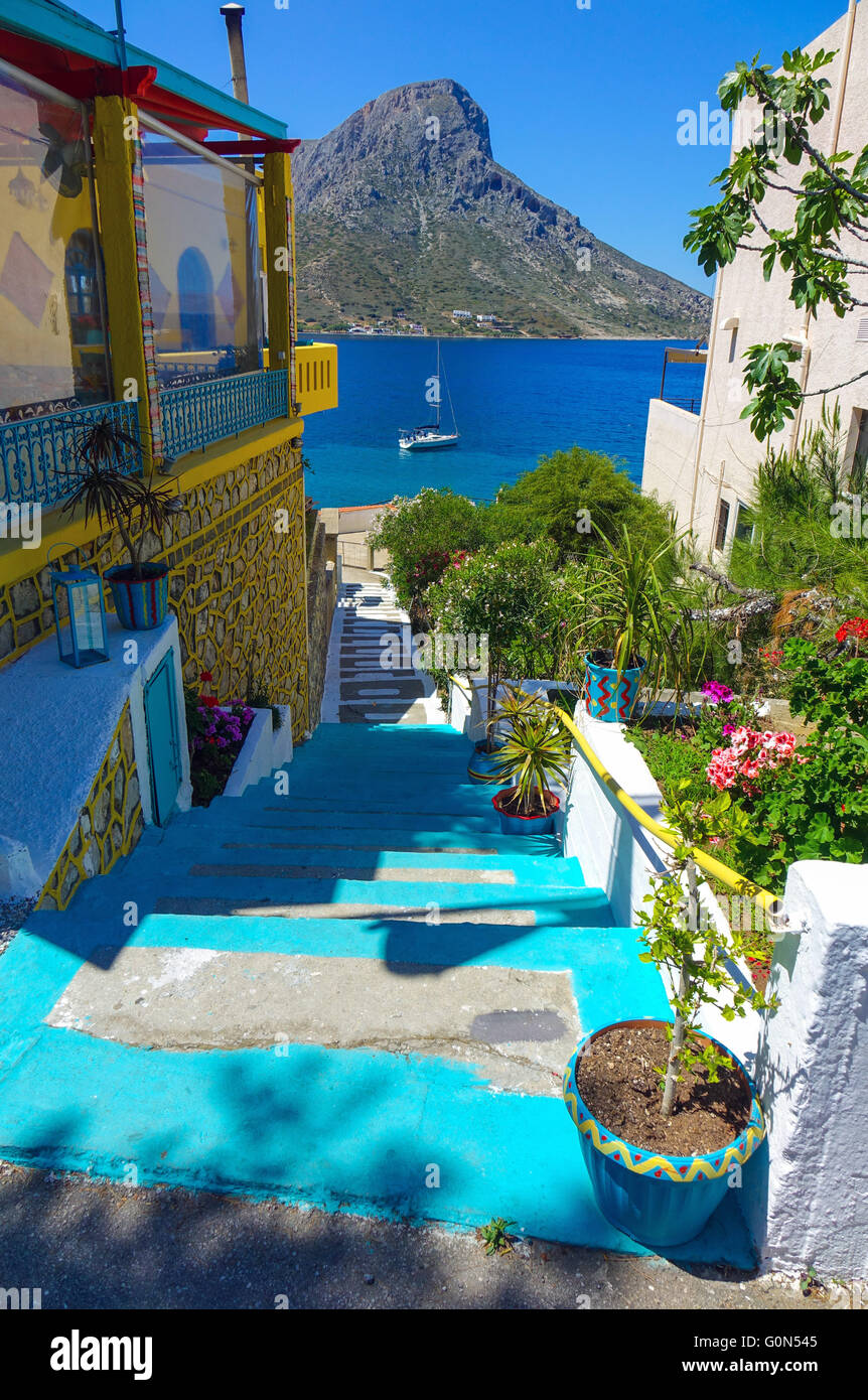 Massouri holiday resort, Kalymnos, Greece with blue steps, moored yacht ...