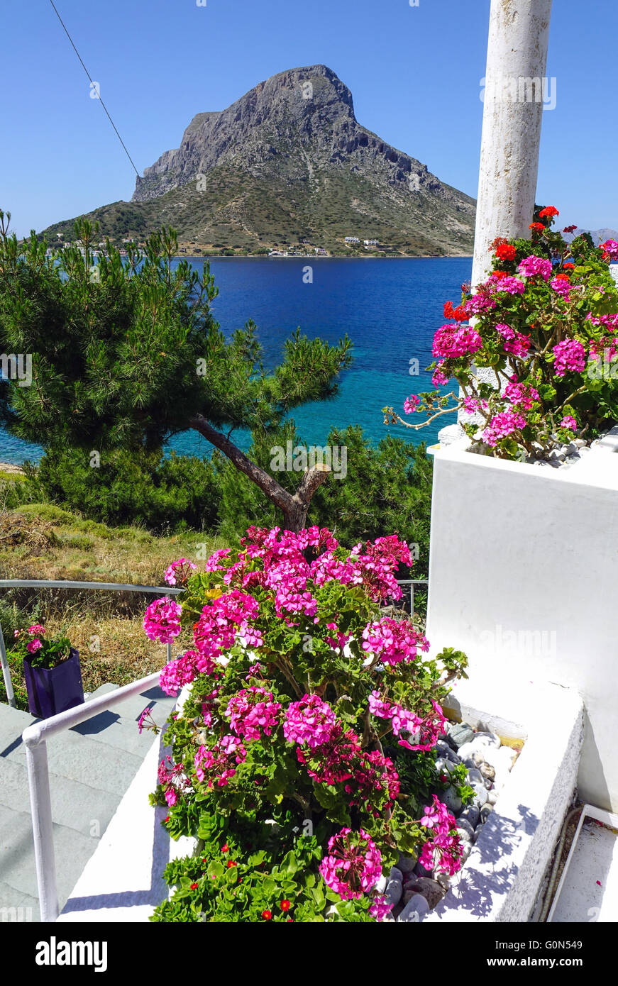 Massouri holiday resort, Kalymnos, Greece, Telendos Island beyond Stock ...