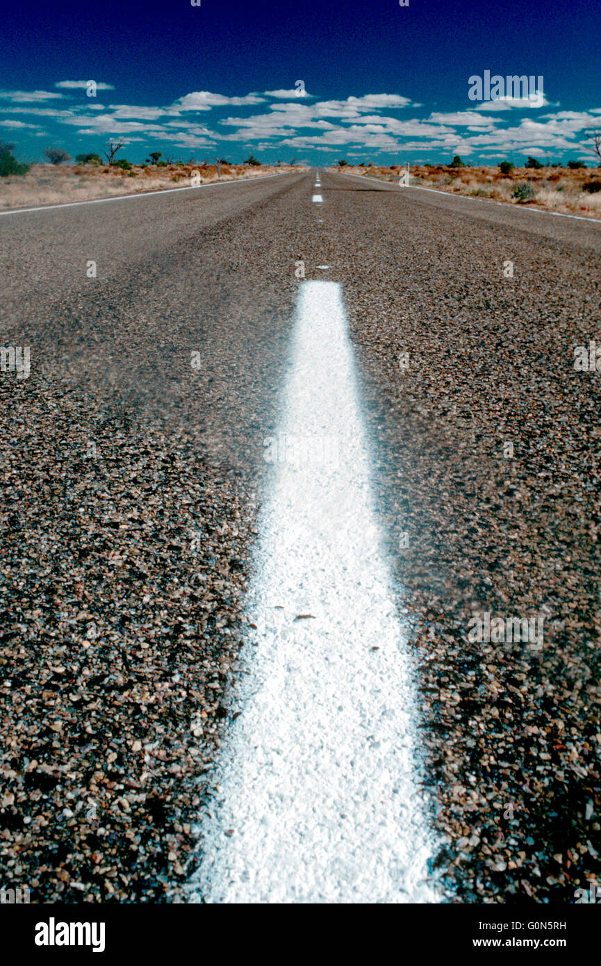 Road scene, Australia, N.T. white line in the m Stock Photo - Alamy