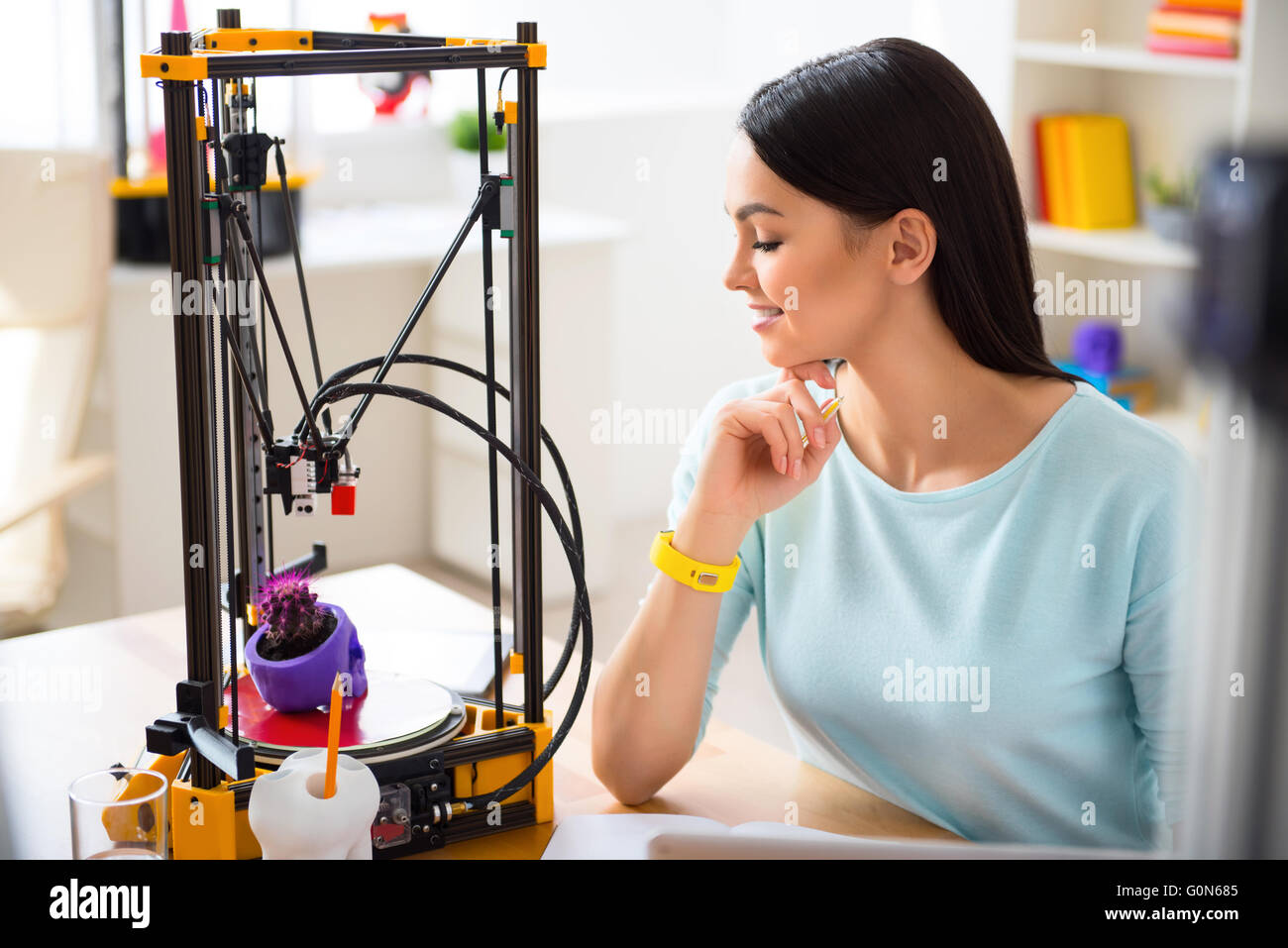 Nice smiling woman using 3d printer Stock Photo - Alamy