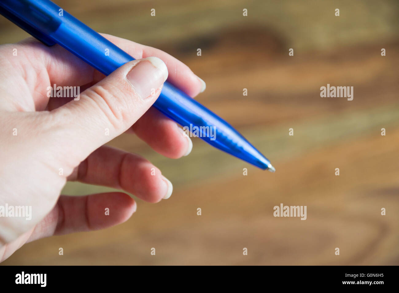 hand with pen Stock Photo - Alamy