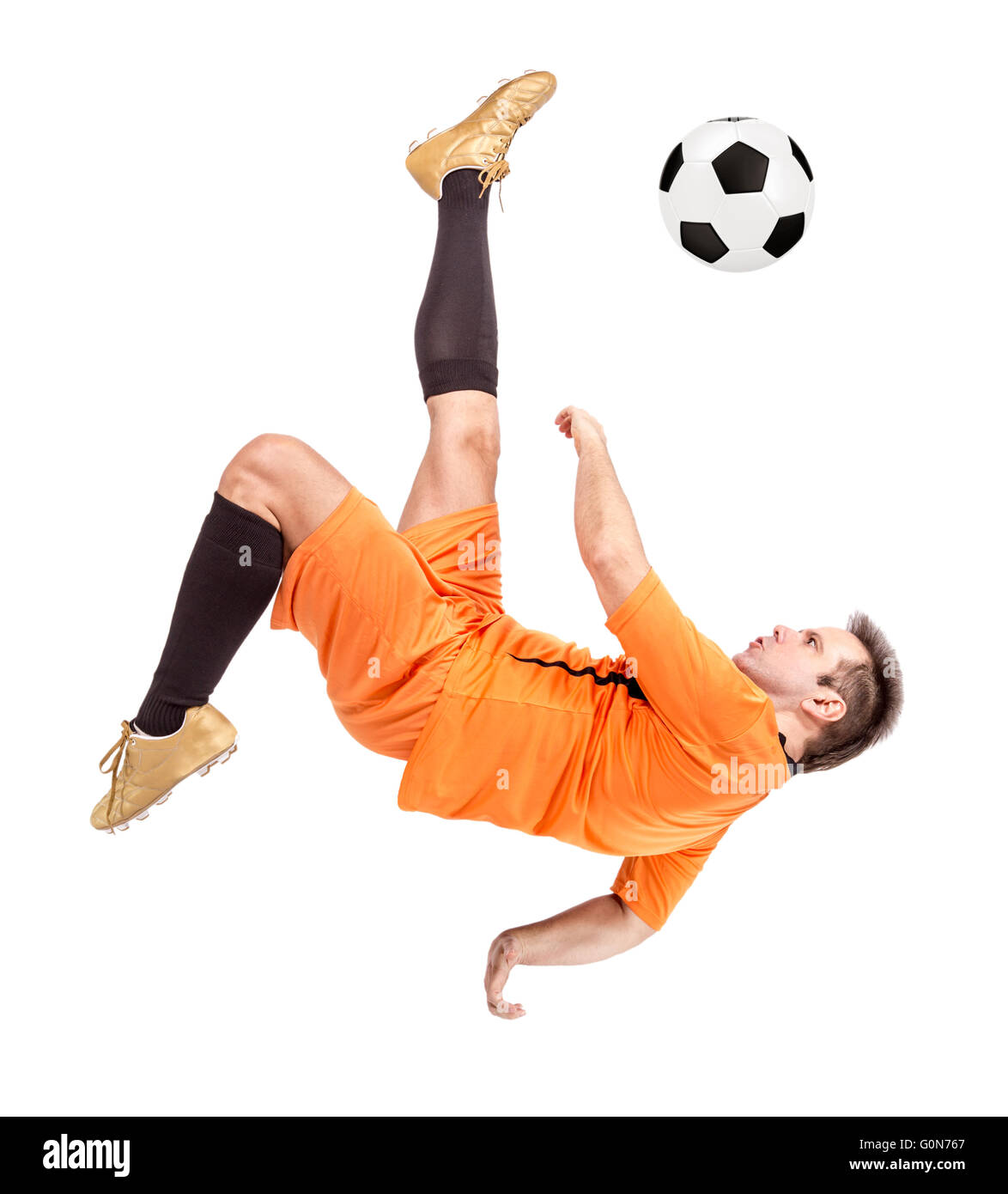 Soccer football player kicking the ball isolated on a white background ...