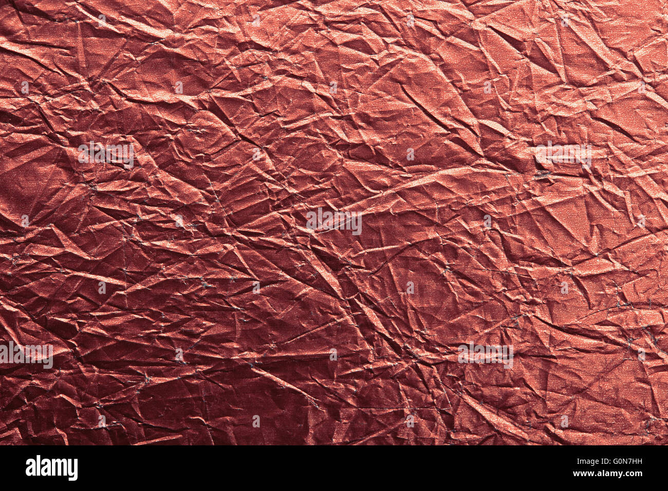 red crumpled paper texture macro Stock Photo - Alamy